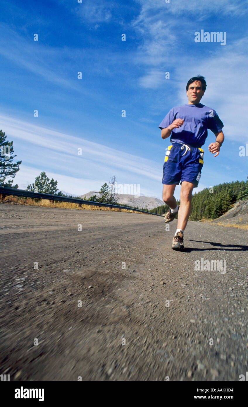 Man running on road Stock Photo - Alamy