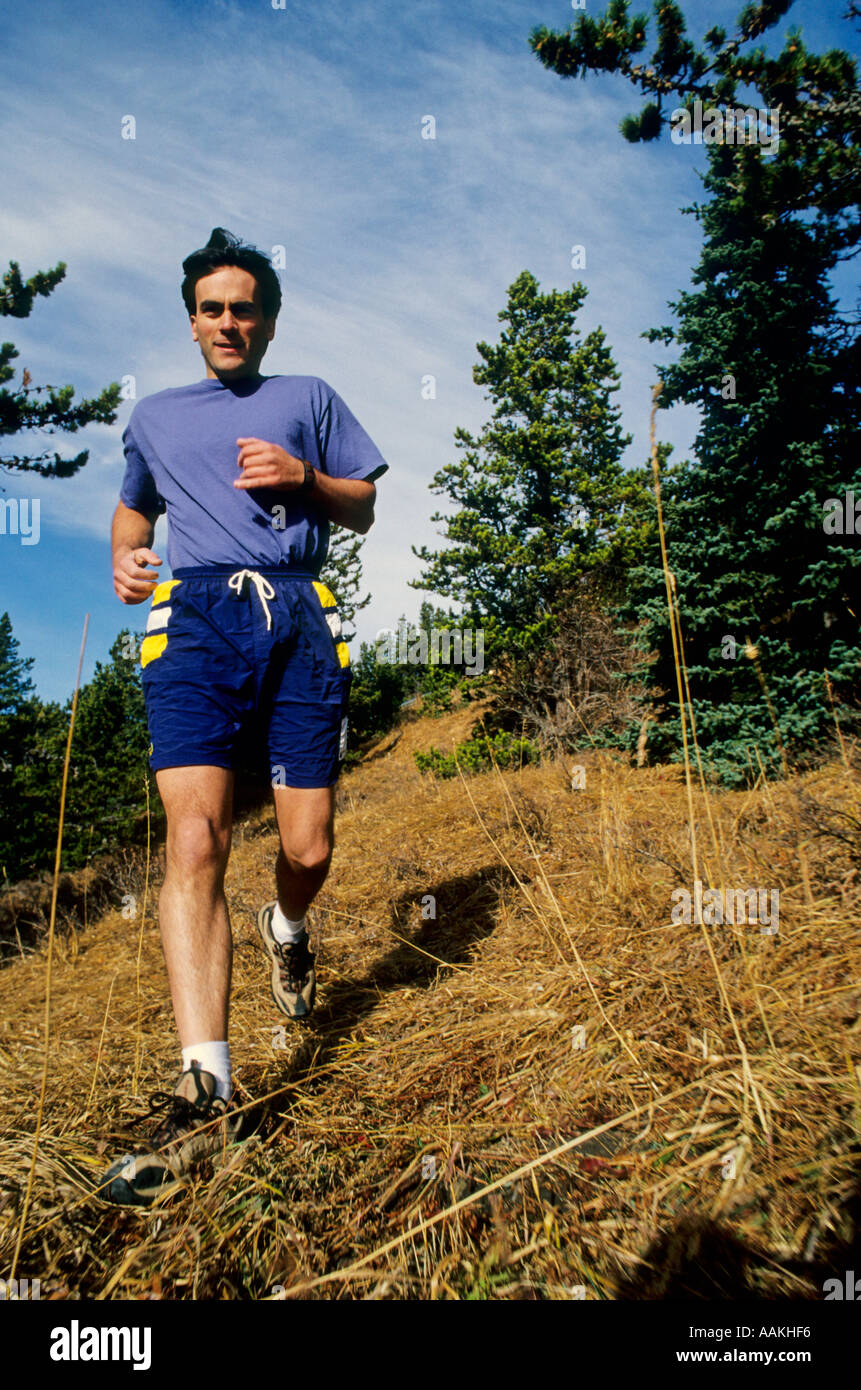 Man running downhill Stock Photo - Alamy