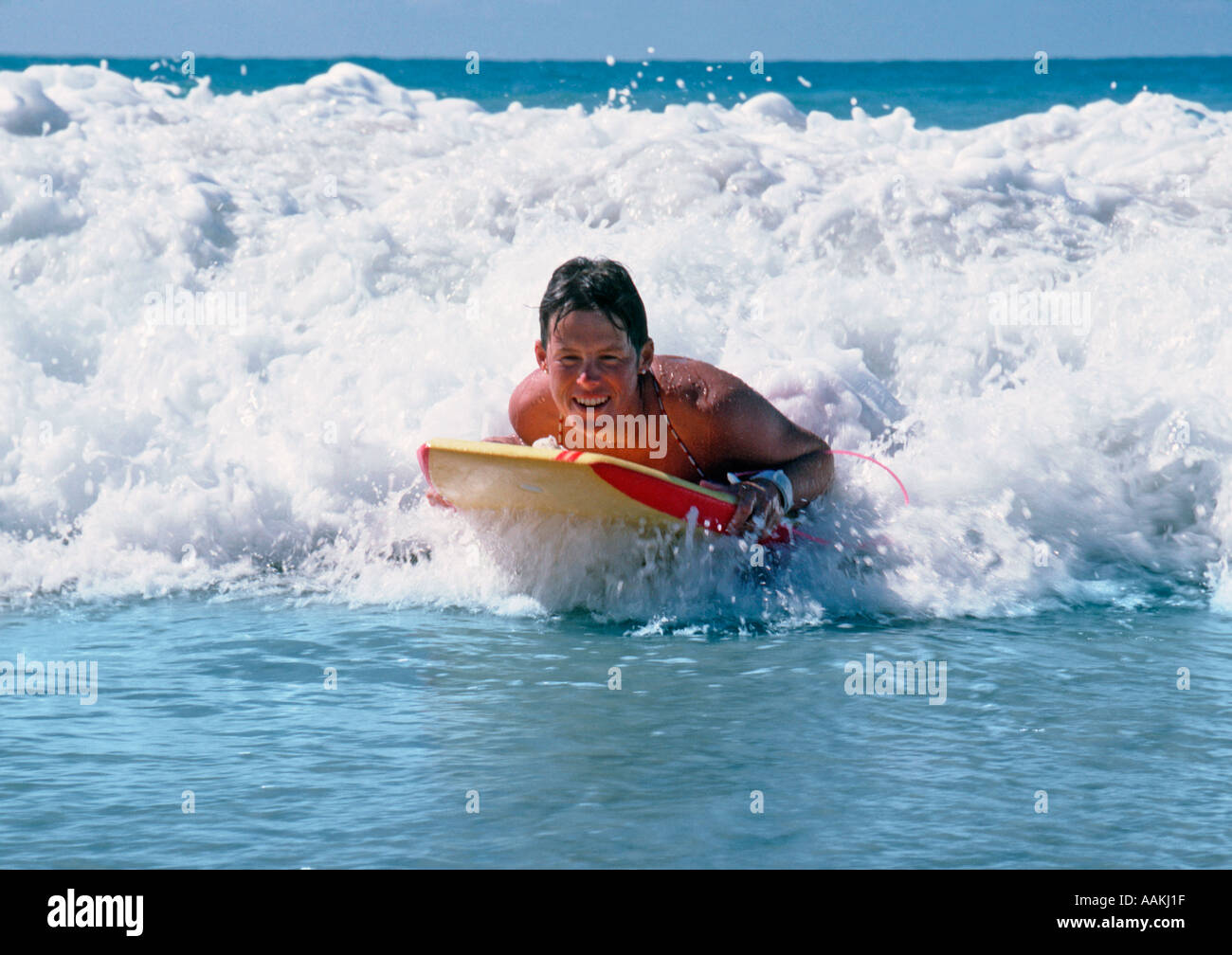 Woman on surf board Model Released Stock Photo - Alamy