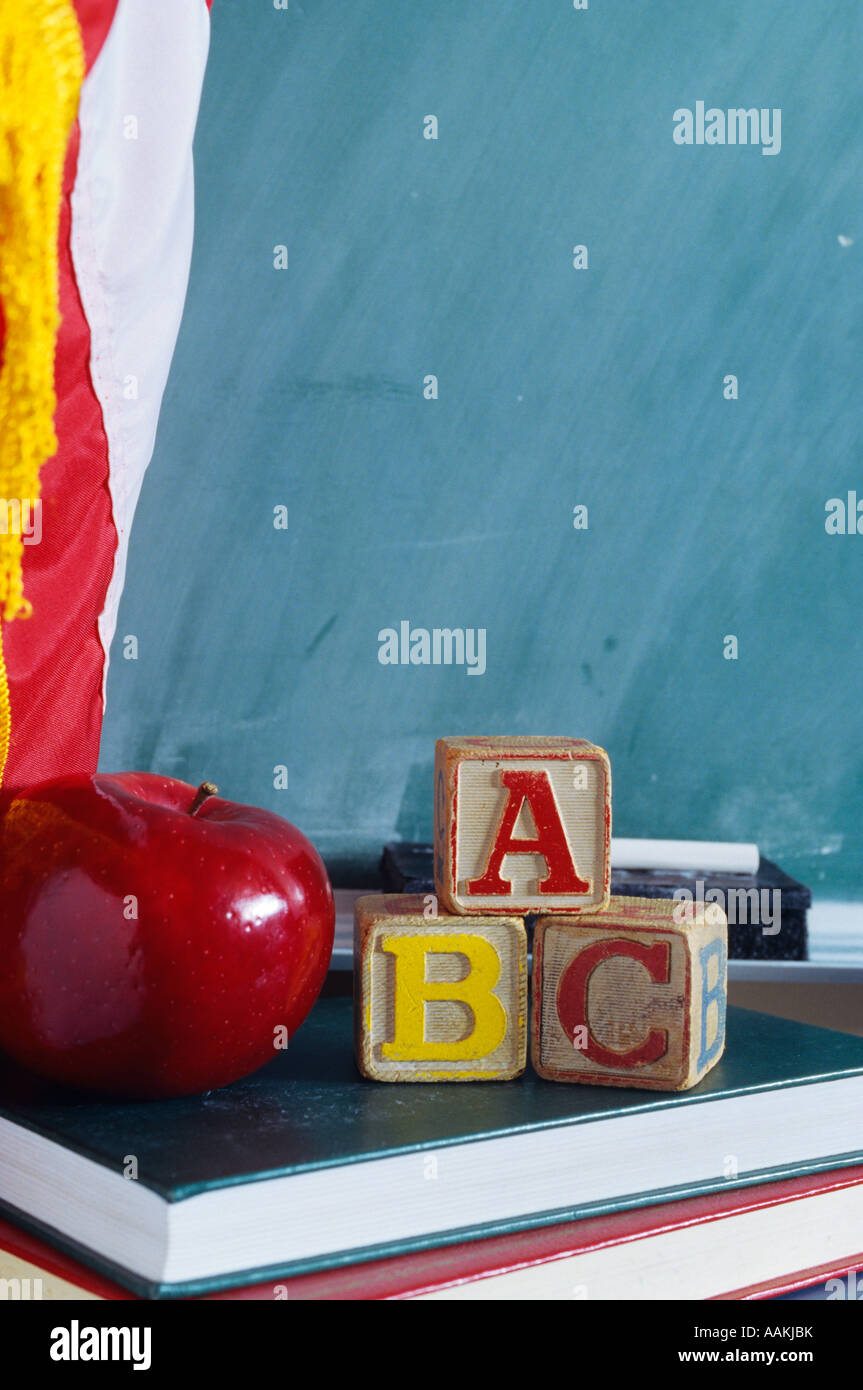 APPLE BOOKS ALPHABET BLOCKS NEAR CHALKBOARD Stock Photo - Alamy