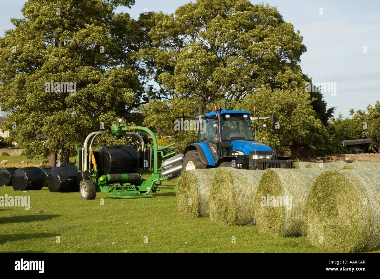 Tractor bale wrapper wrapping bales hi-res stock photography and images ...