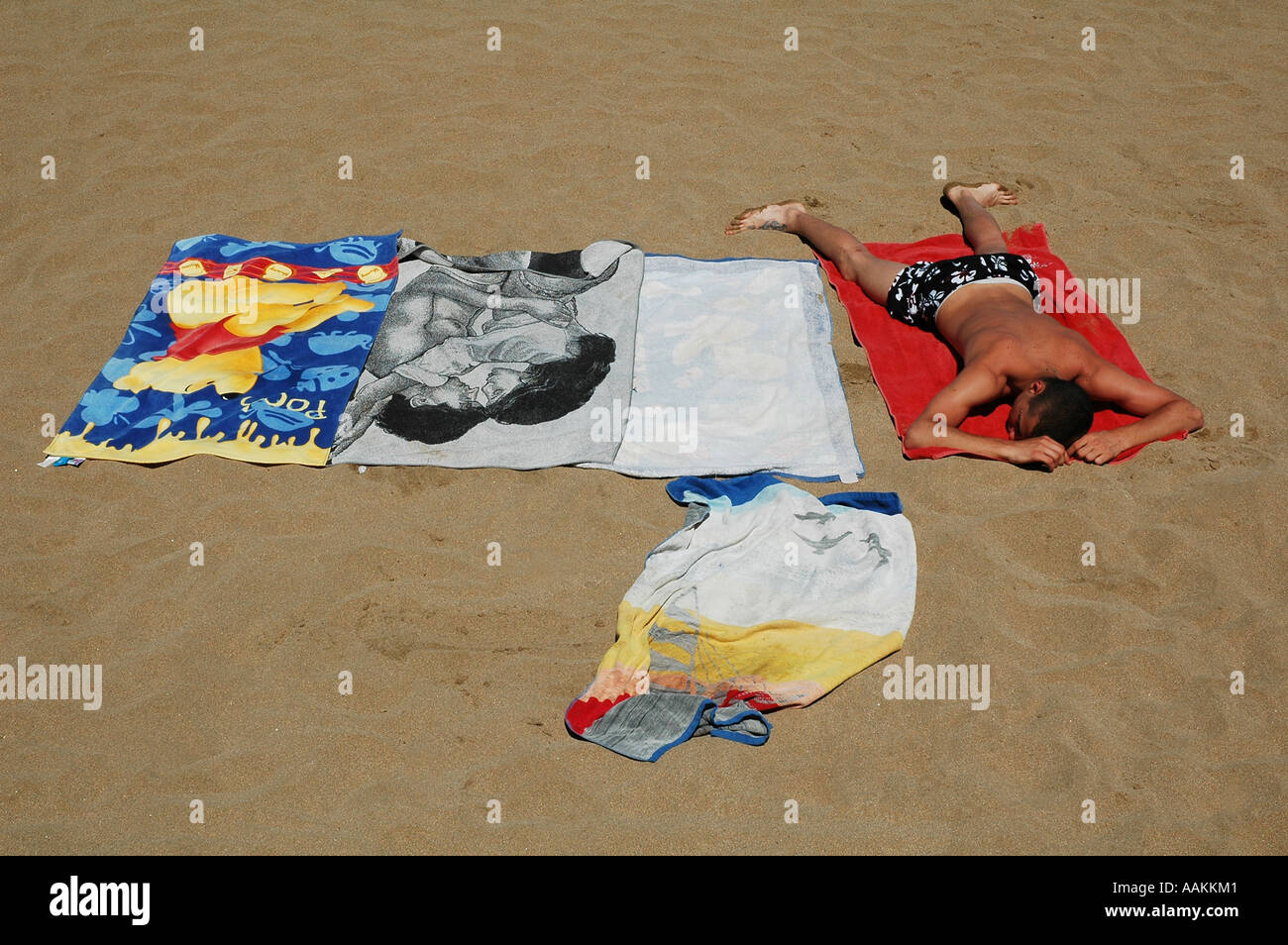 Tourist sunbathing in a sandy beach Canary Island Spain Stock Photo - Alamy