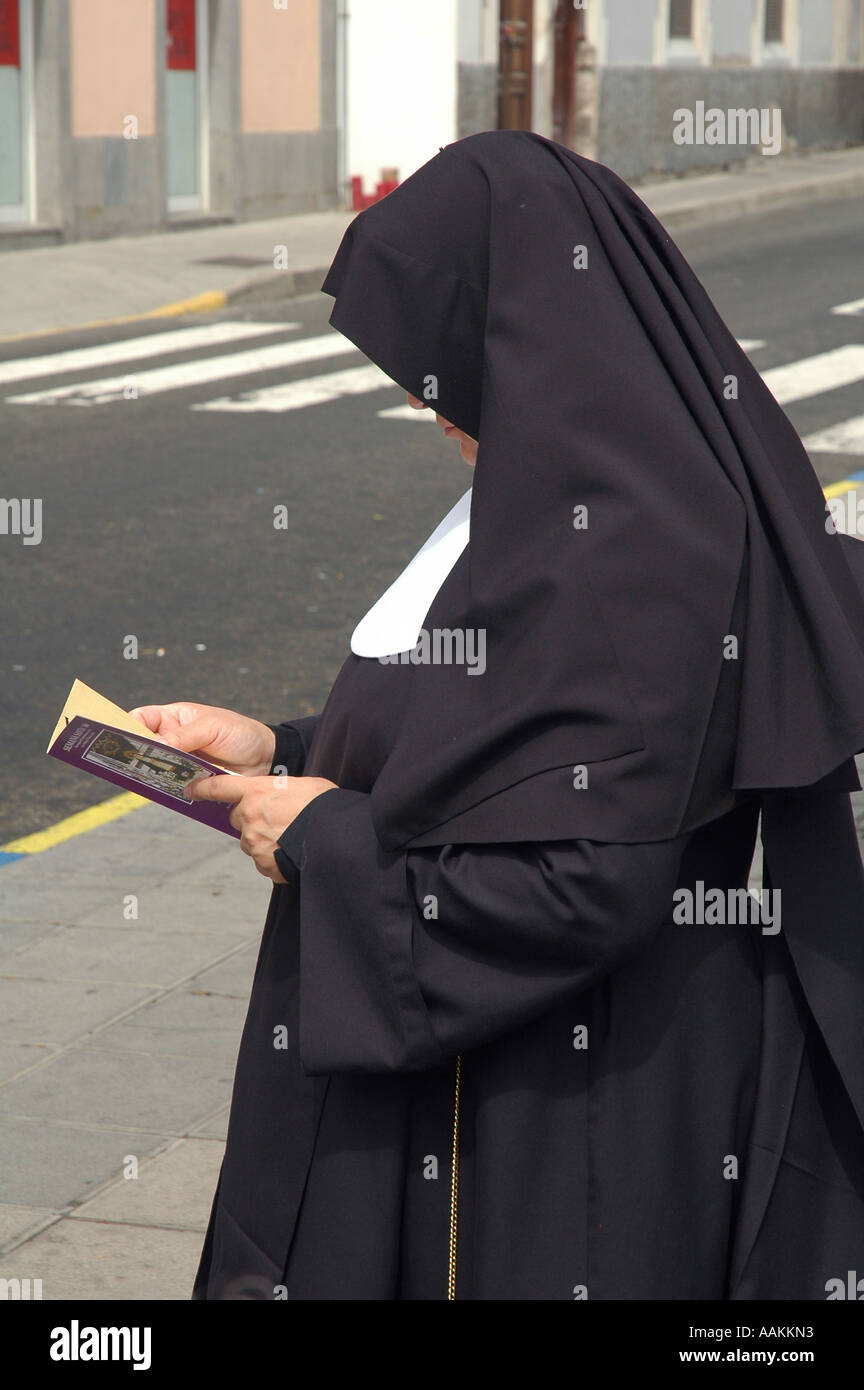 Nun reading sacred book Spain Stock Photo - Alamy