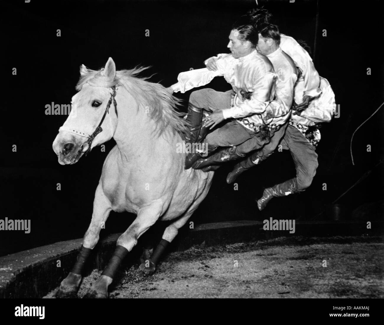 1930s 1940s FOUR MEN RIDING HORSE AROUND CIRCUS RING TRACK Stock Photo ...
