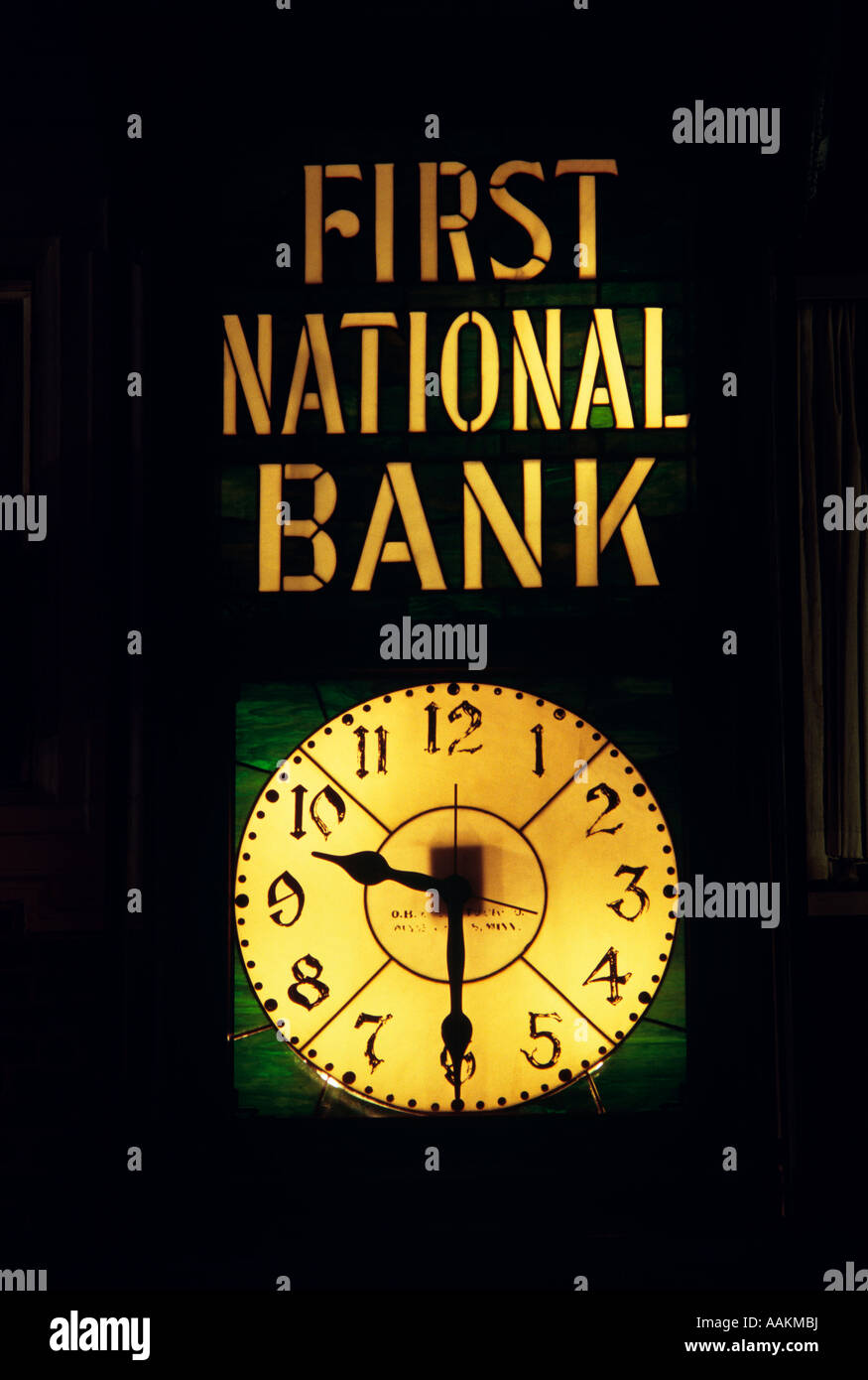 1980s ILLUMINATED OLD FIRST NATIONAL BANK CLOCK SIGN LIT AT NIGHT Stock ...