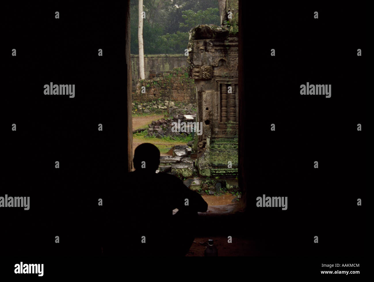 Person sitting in doorway at Angkor Wat, a temple at Angkor, Cambodia ...