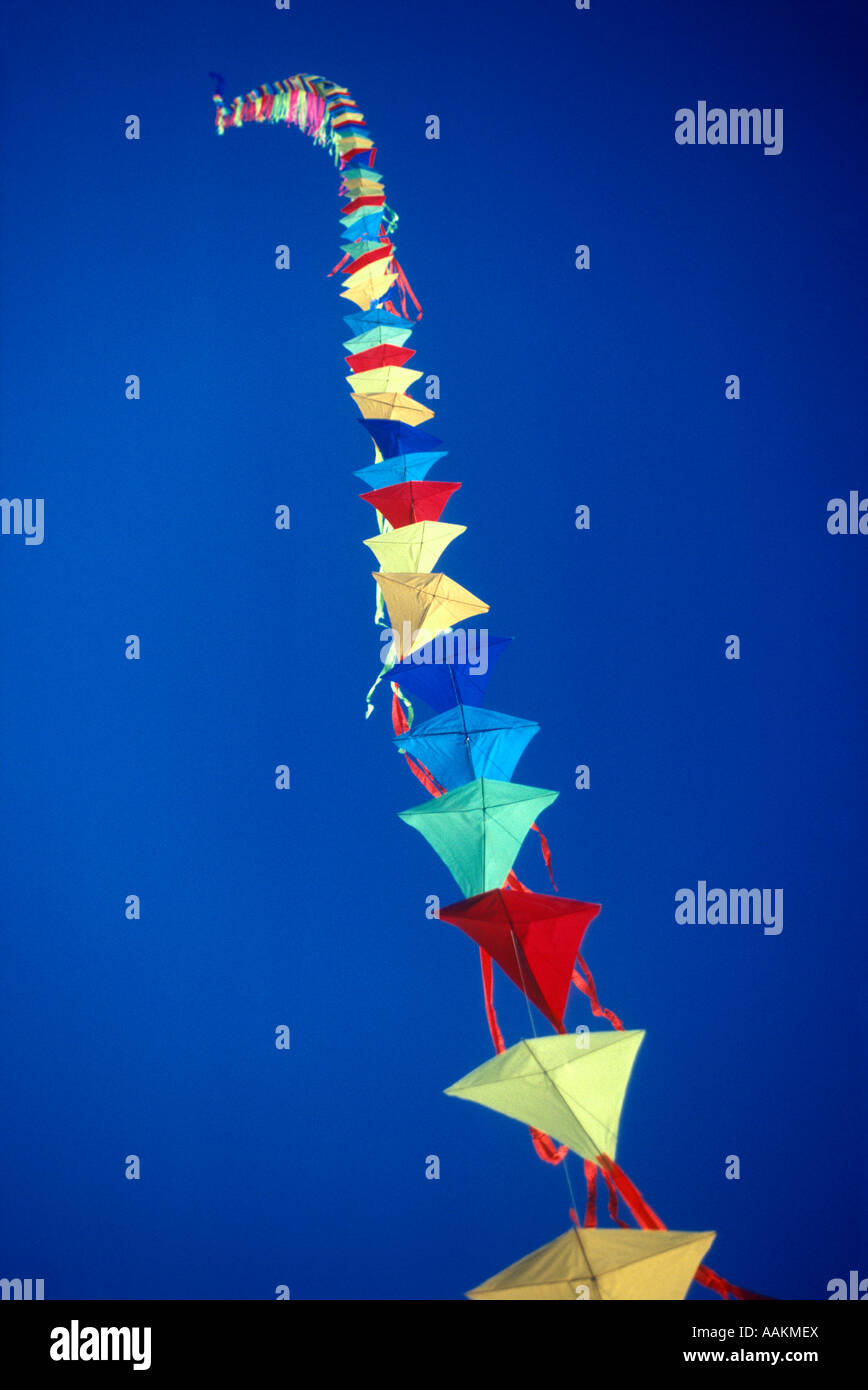 LONG STRING OF KITES FLYING TOGETHER Stock Photo - Alamy