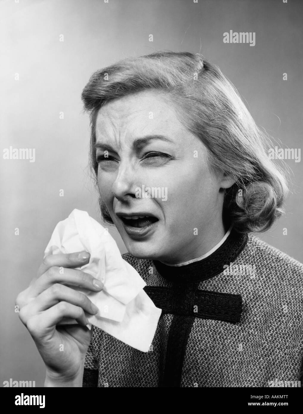 1950s WOMAN WITH HANDKERCHIEF SNEEZING INDOOR Stock Photo - Alamy