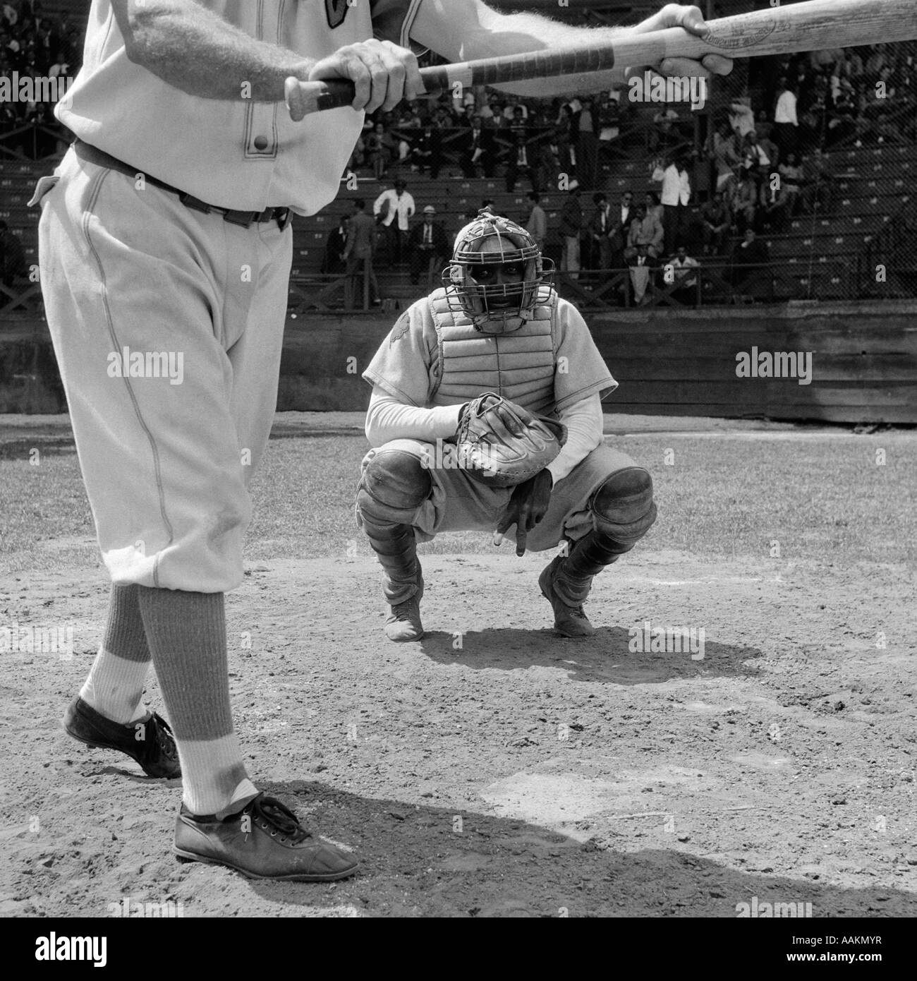 1950s BASEBALL PLAYER ABOUT TO BUNT CATCHER GIVING HAND SIGNAL Stock ...