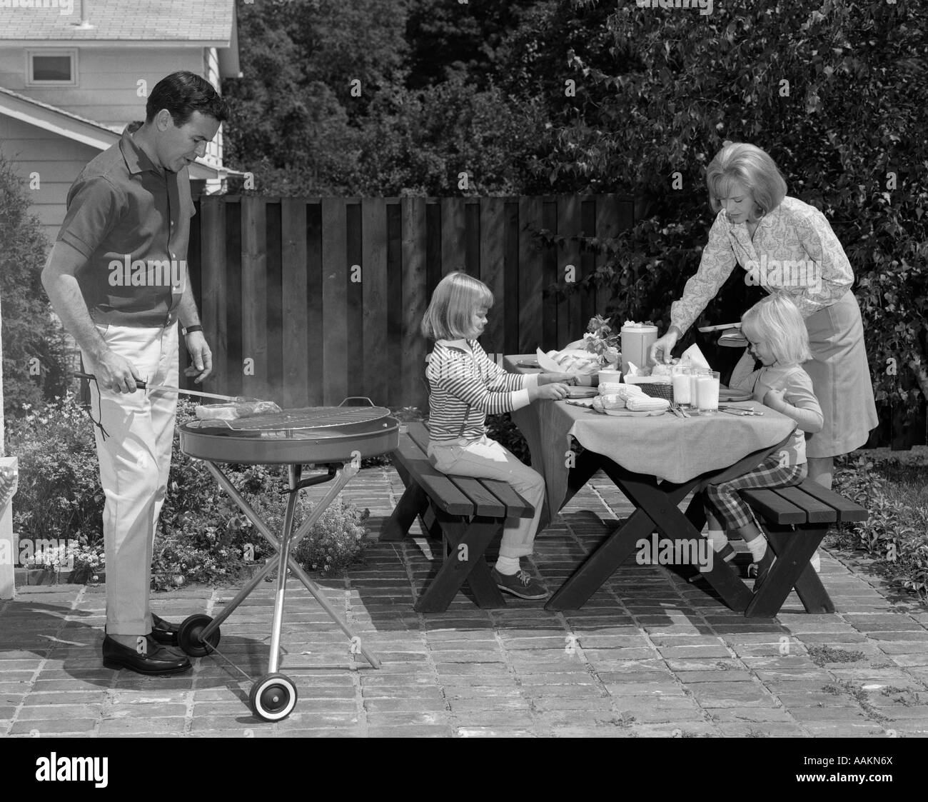 Man seated table smiling Black and White Stock Photos & Images - Alamy
