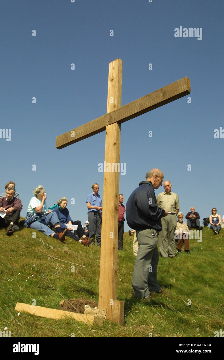 A wooden cross on a hillside at Easter marks the spot for an outdoor ...