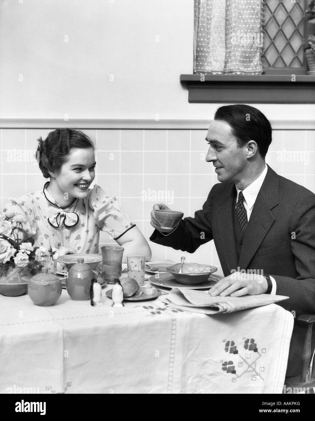 1930s COUPLE EATING BREAKFAST DRINKING COFFEE AND READING NEWSPAPER ...
