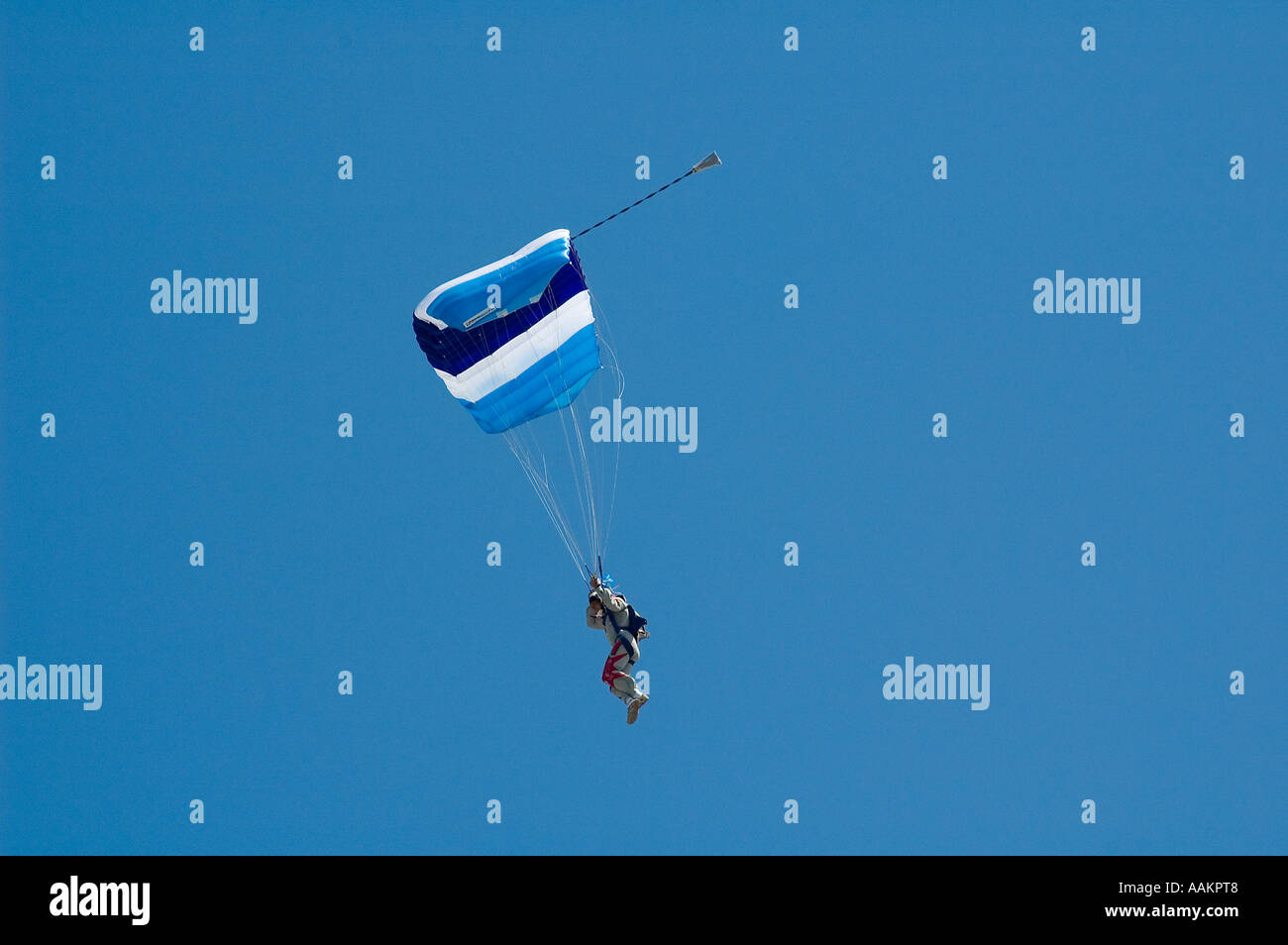 Skydiver jumper landing a square ram air parachute Stock Photo - Alamy