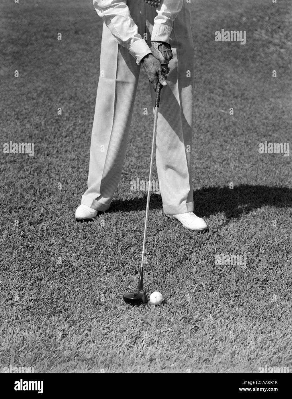1930s 1940s MAN WAIST DOWN WITH GOLF CLUB ADDRESSING BALL Stock Photo ...