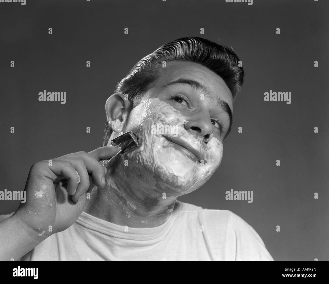 Boy shaving with safety razor hi-res stock photography and images - Alamy