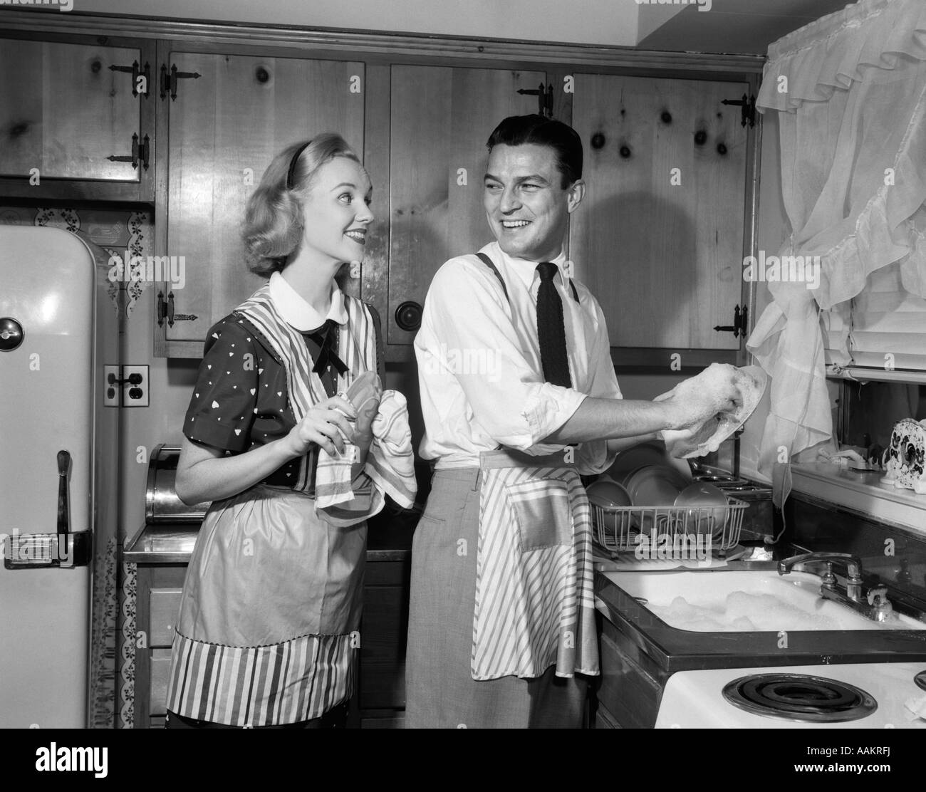 1950s SMILING HAPPY COUPLE MAN AND WOMAN HUSBAND AND WIFE WASHING ...