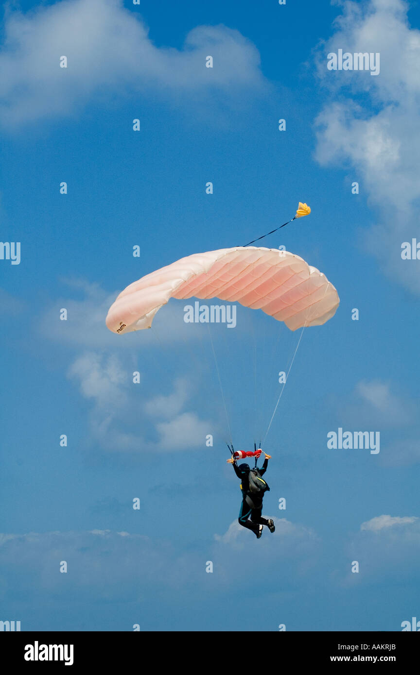Skydiver jumper landing a square ram air parachute Stock Photo - Alamy