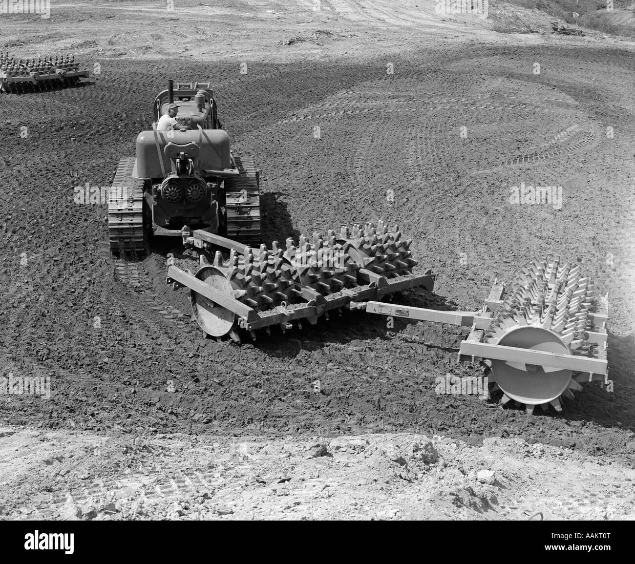 1960s MAN OPERATING GRADING MACHINE IN SOIL CONSTRUCTION SITE HEAVY ...