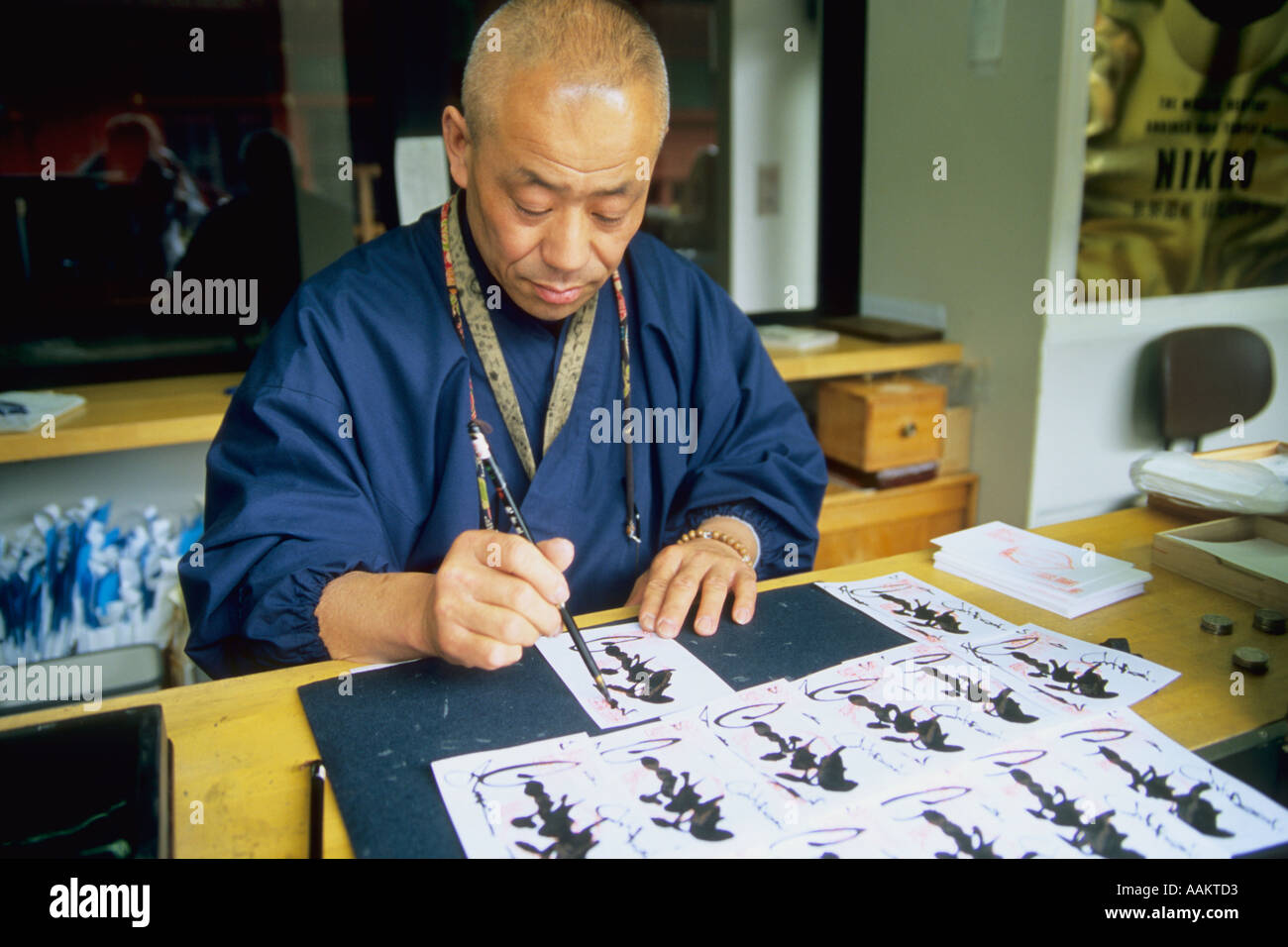 Japan Nikko priest doing calligraphy Stock Photo - Alamy