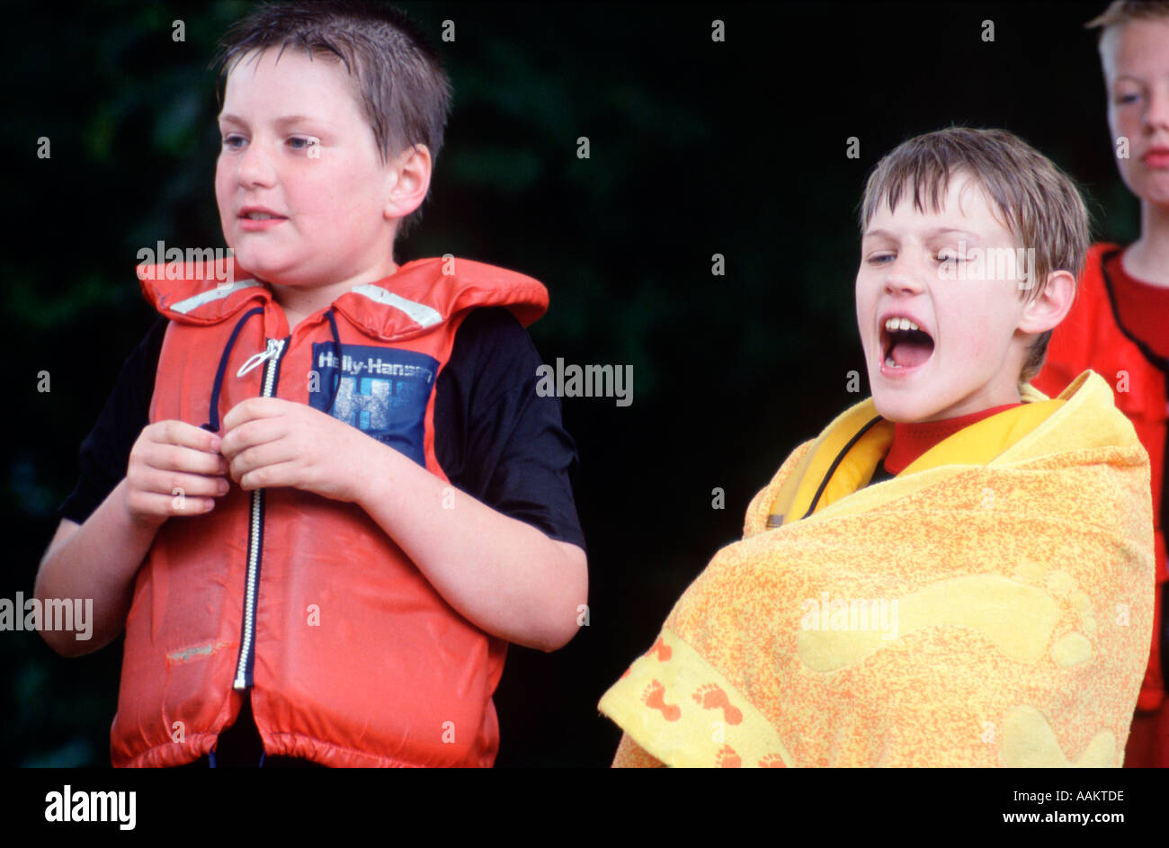 Two Cub Scouts aged 10 to 12 years watch mop jousting in canoes on ...