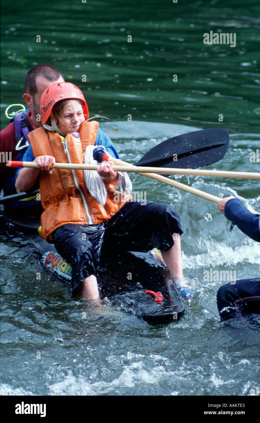 Cub Scouts aged 10 to 12 years play mop jousting in canoes on River ...