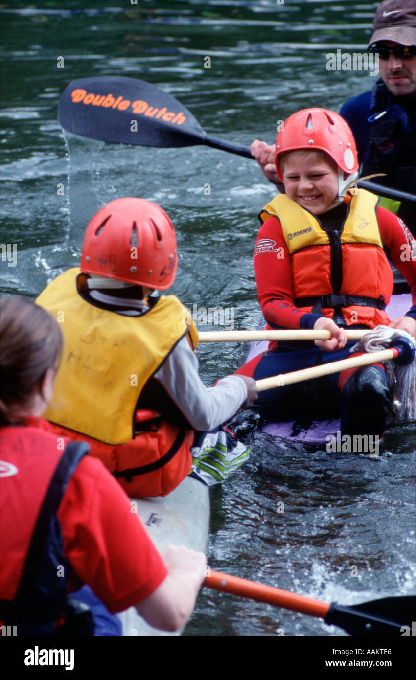 Cub Scouts aged 10 to 12 years play mop jousting in canoes on River ...