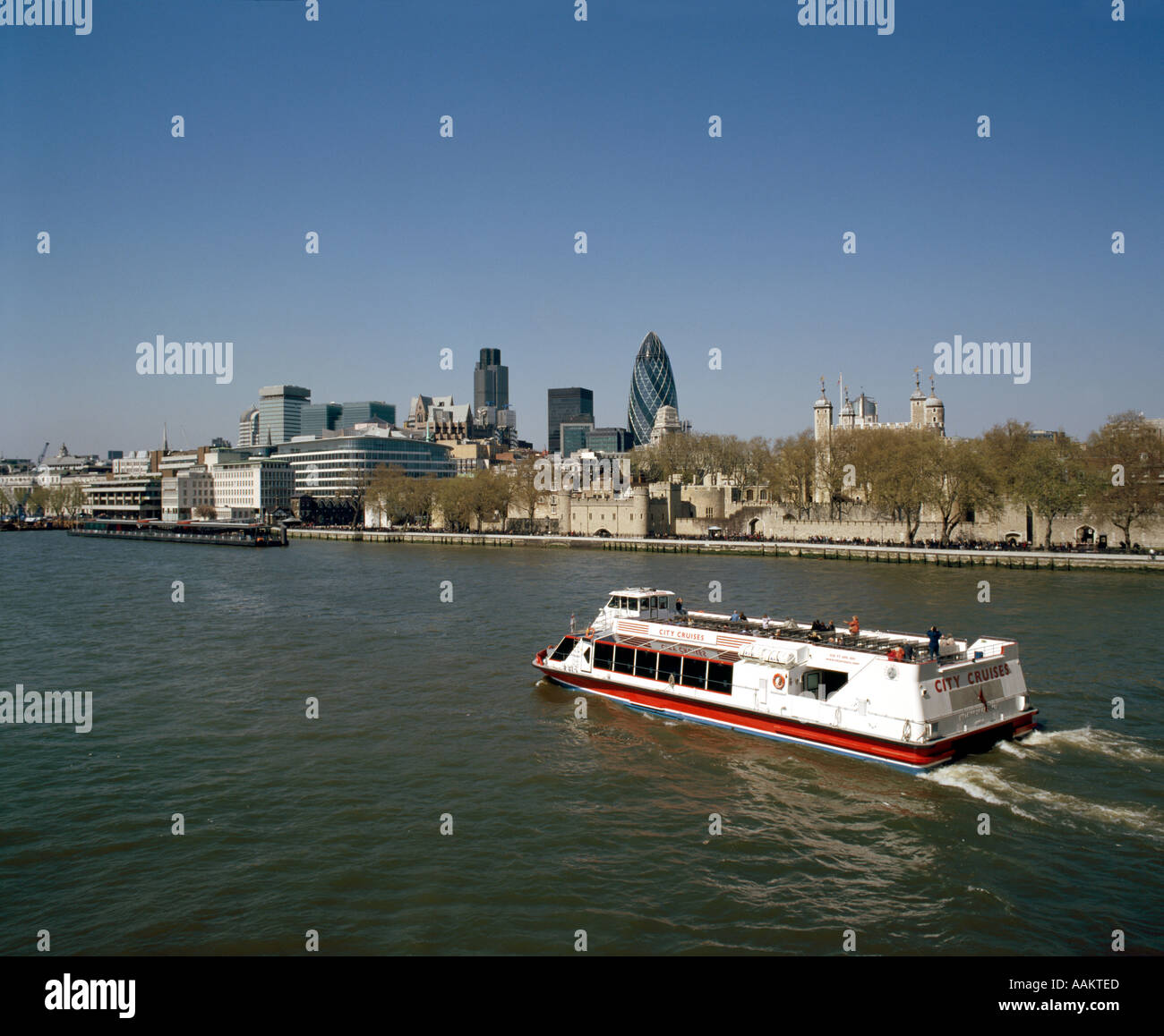 Tourist boat on River Thames photographed from Tower Bridge in London ...