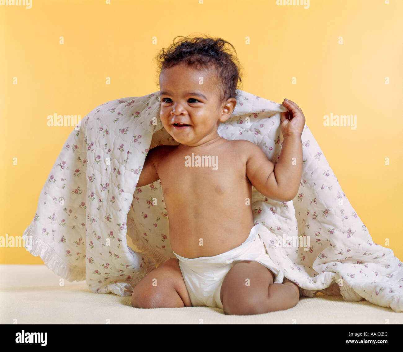 1970s AFRICAN AMERICAN BABY SMILING HOLDING BLANKET OVER SHOULDERS ...