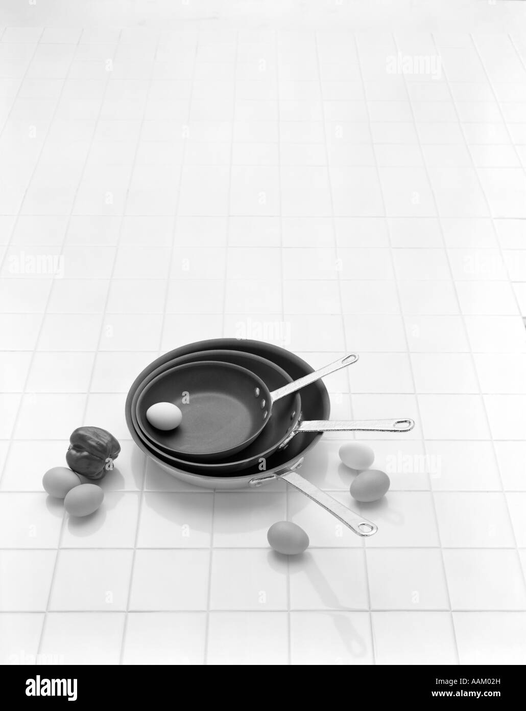 EGGS FRYING PANS TILE COUNTER Stock Photo - Alamy
