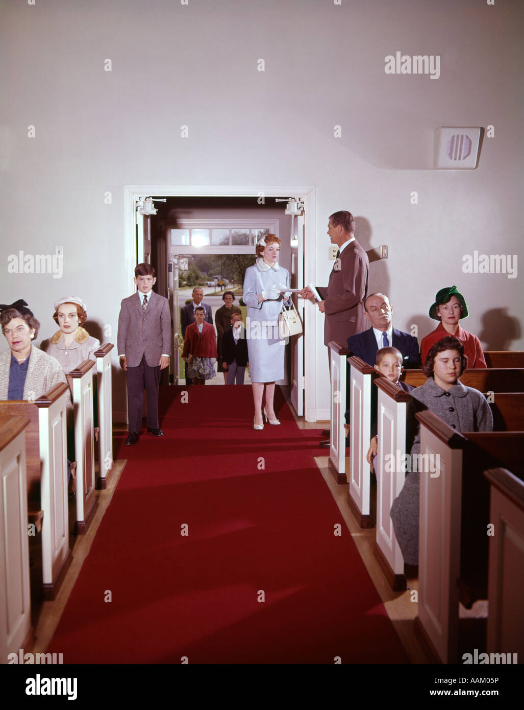 1950s CHURCH INTERIOR AISLE PEOPLE MEN WOMEN CHILDREN SEATED IN PEWS ...