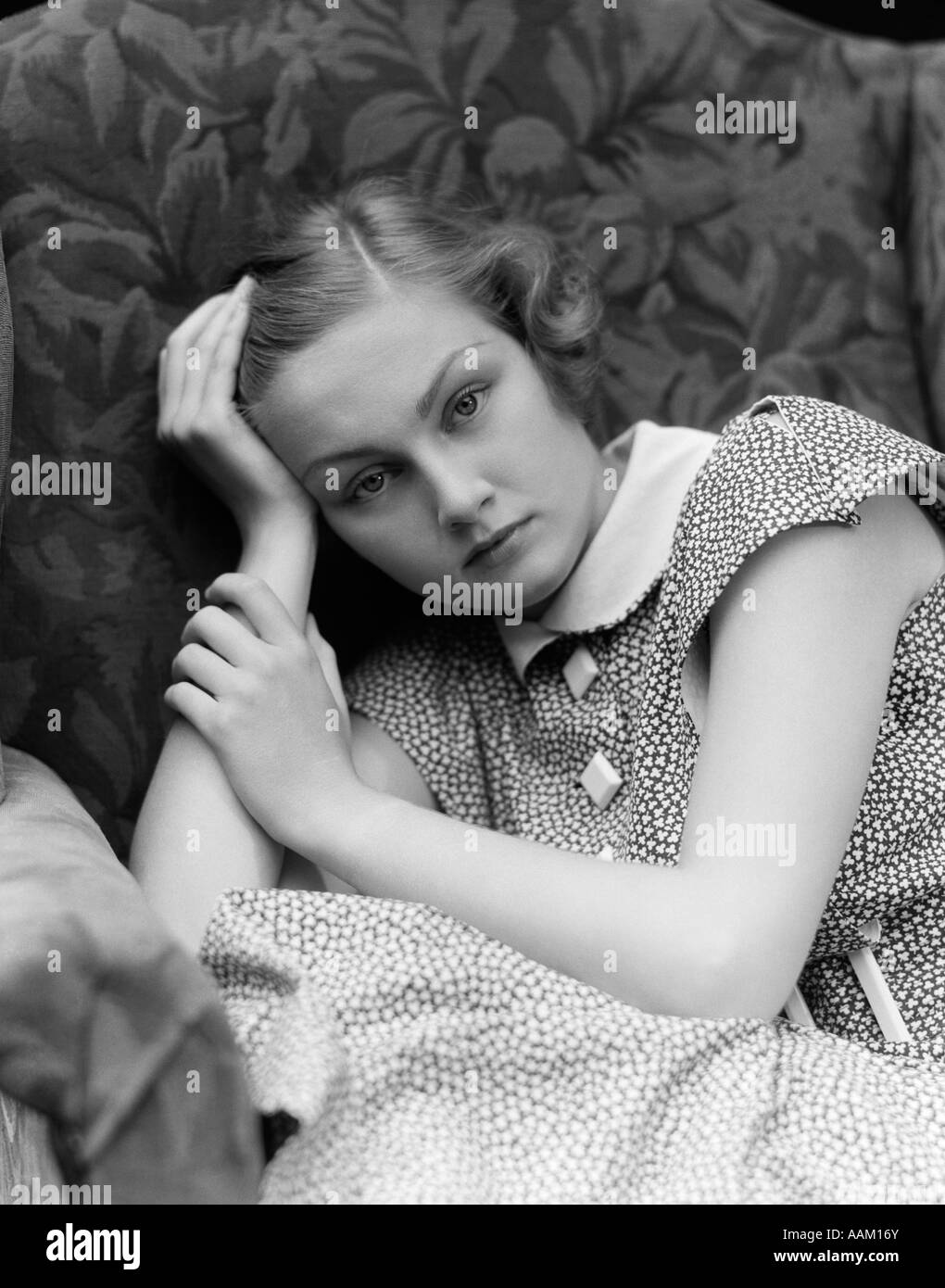 1930s WOMAN MOPING LOOKING SAD OR DEPRESSED OR WITH A HEADACHE LEANING ...