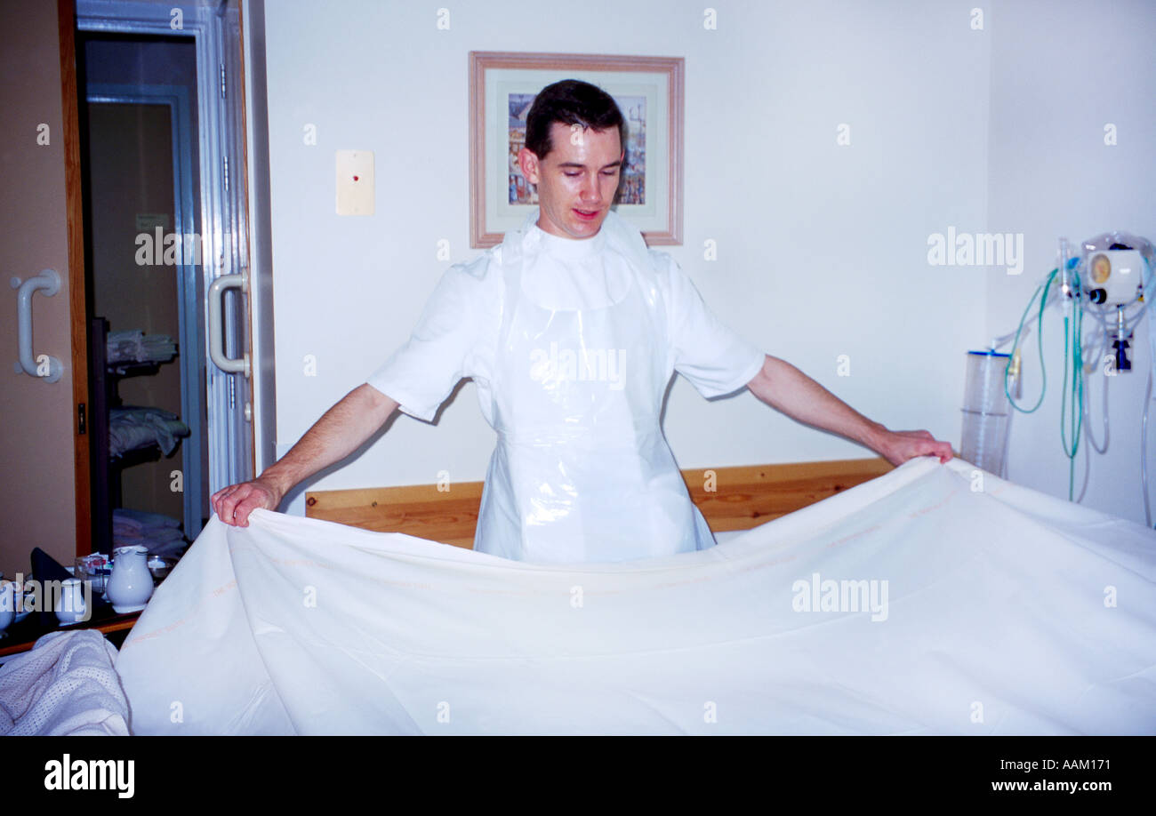 Male nurse making bed hi-res stock photography and images - Alamy