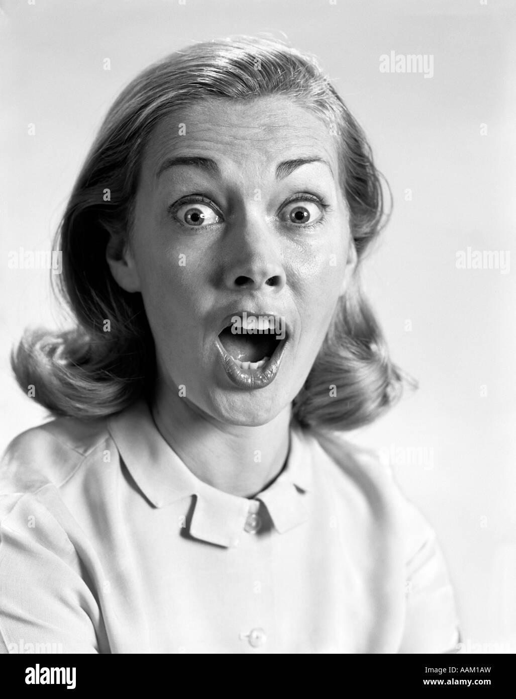 1960s HEAD SHOT WOMAN EYES AND MOUTH WIDE OPEN TERRIFIED EXPRESSION ...