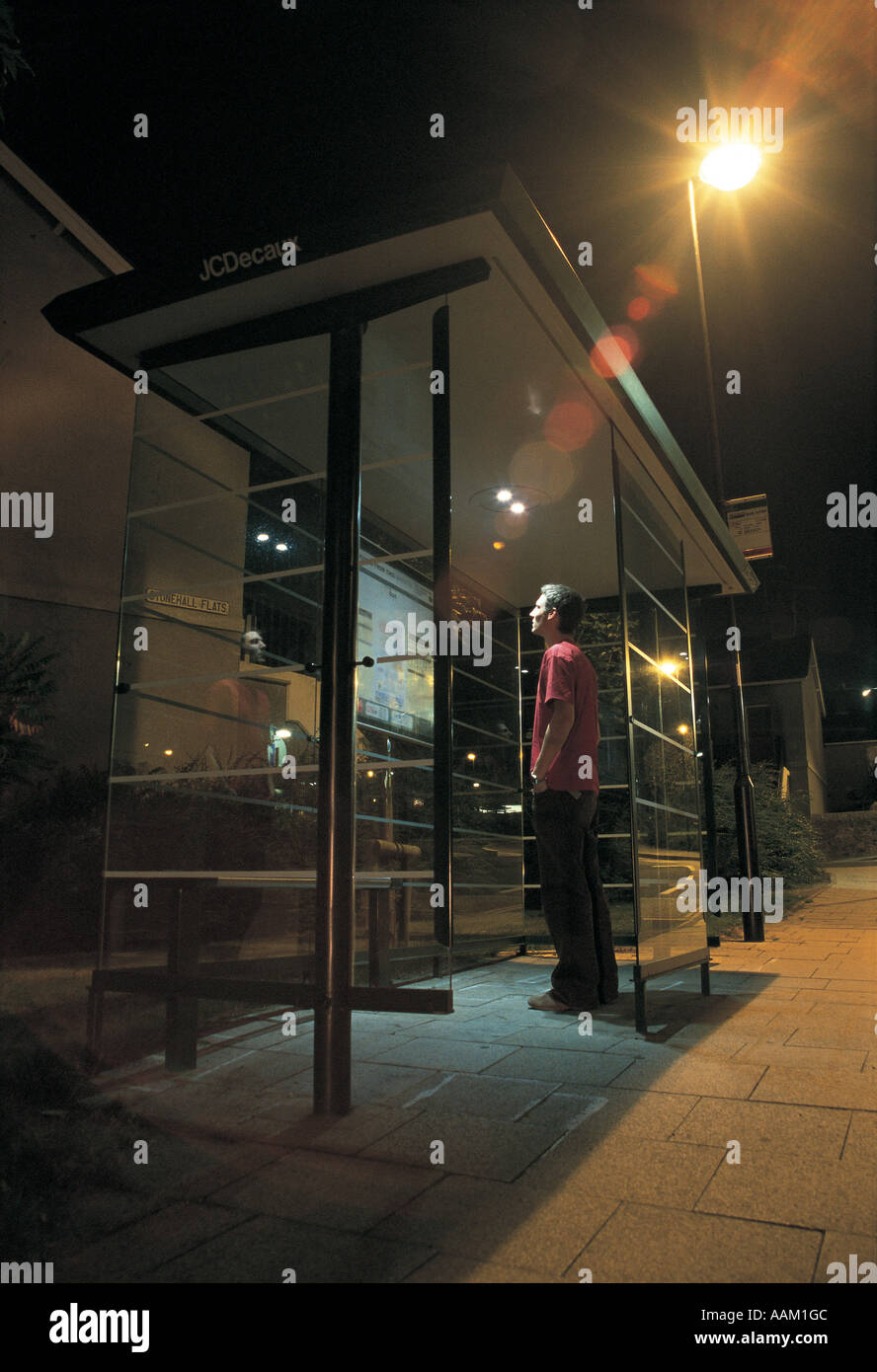 Man Waiting At Bus Stop At Night High Resolution Stock Photography and ...
