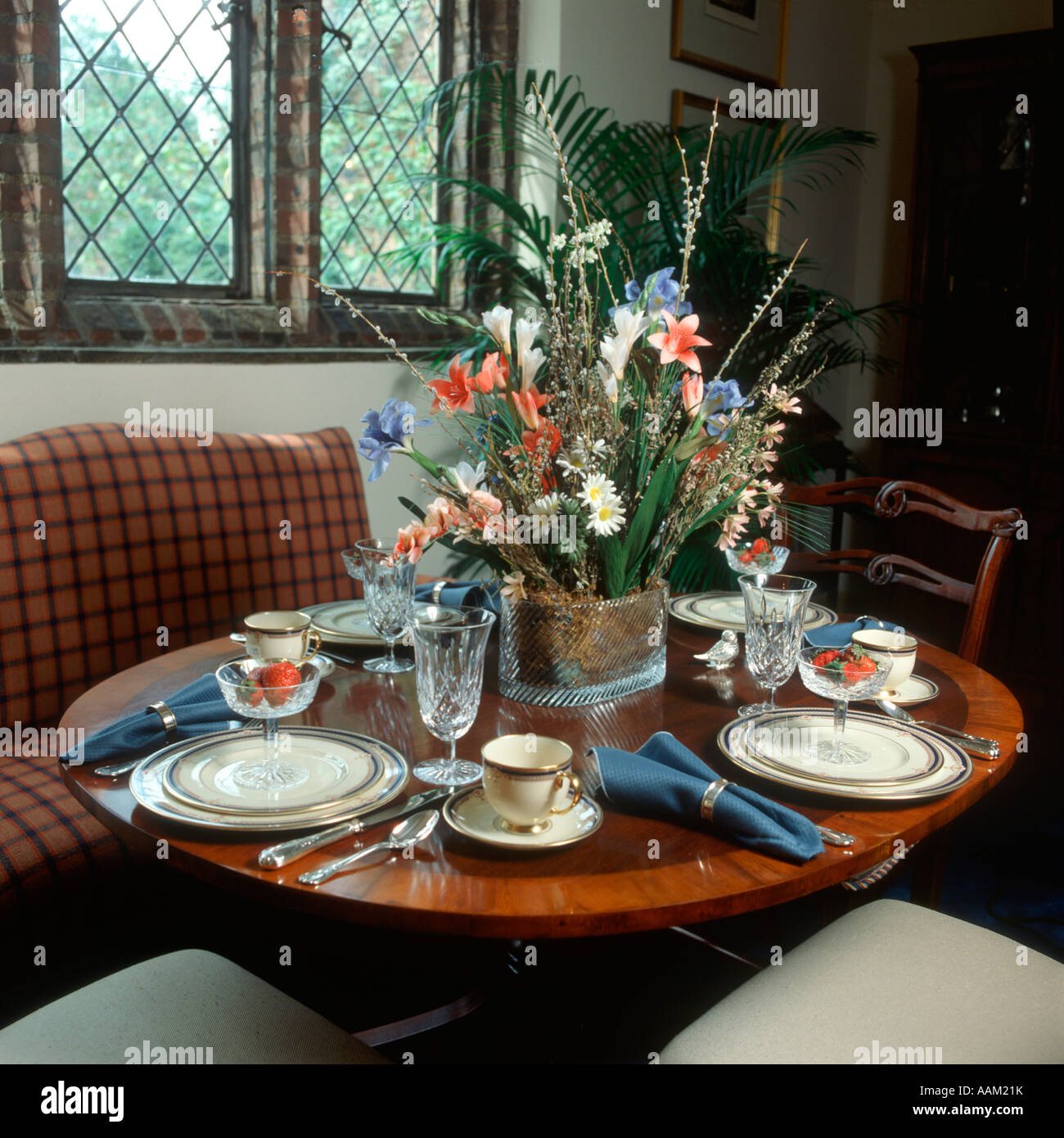 ELEGANT INTIMATE TABLE SETTING WITH FLOWERS OLD INN WINDOW WITH LEADED ...