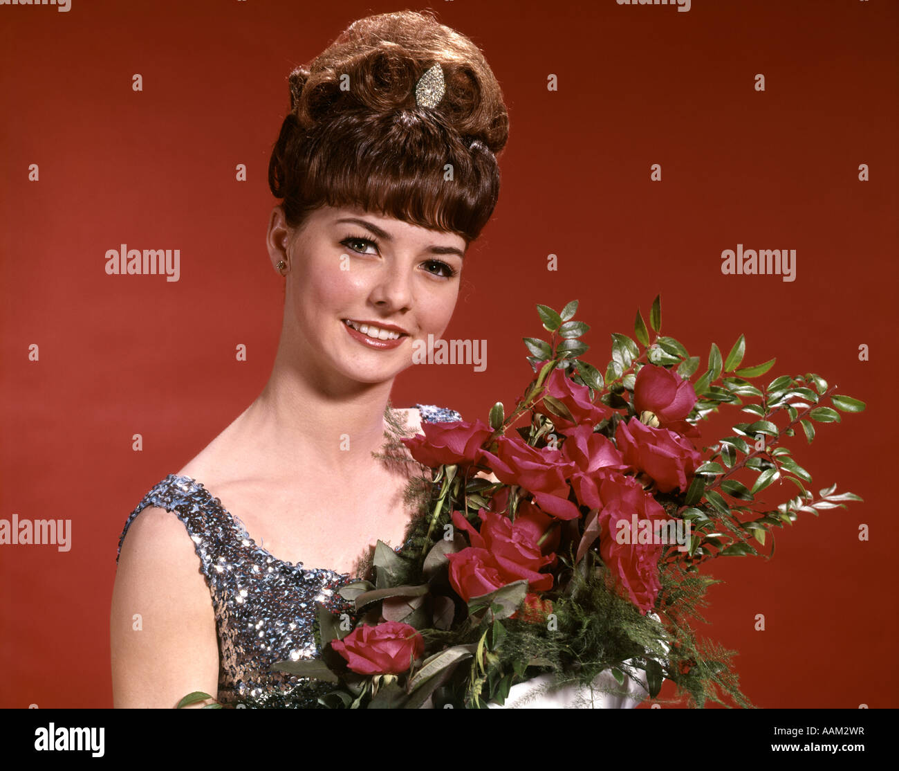 1960s YOUNG WOMAN PROM BEAUTY QUEEN DEBUTANTE HOLDING FLOWERS FLORAL ...