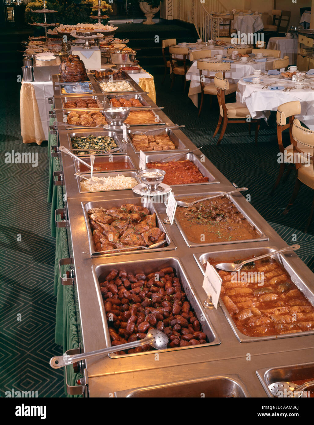 1950s 1960s BUFFET OF HOT DINNER FOODS IN BANQUET ROOM DESSERT TABLE IN ...