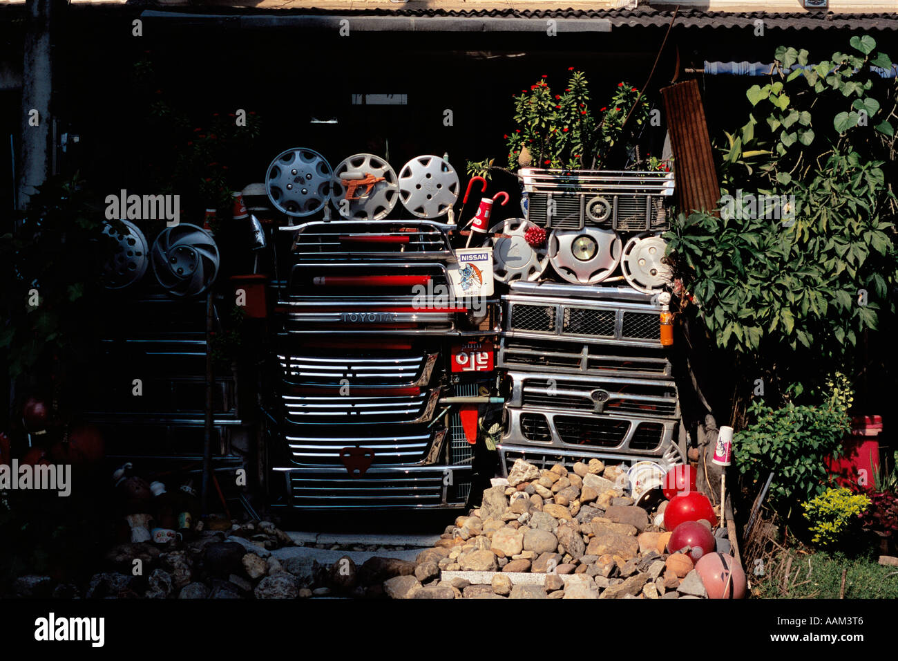 Fence made from auto parts, Chiang Mai, Thailand Stock Photo - Alamy