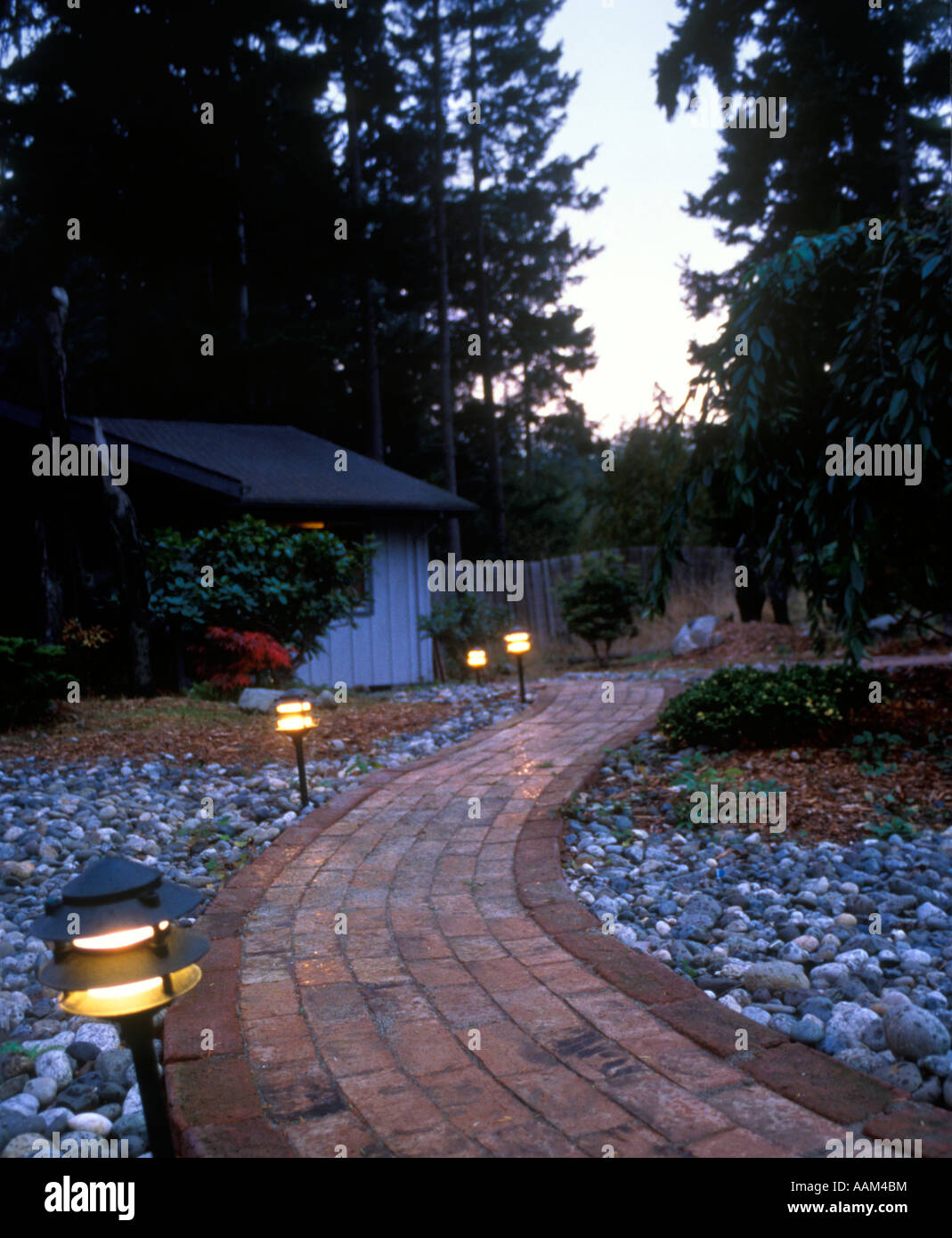 LIGHTED BRICK WALL IN RESIDENTIAL YARD Stock Photo - Alamy