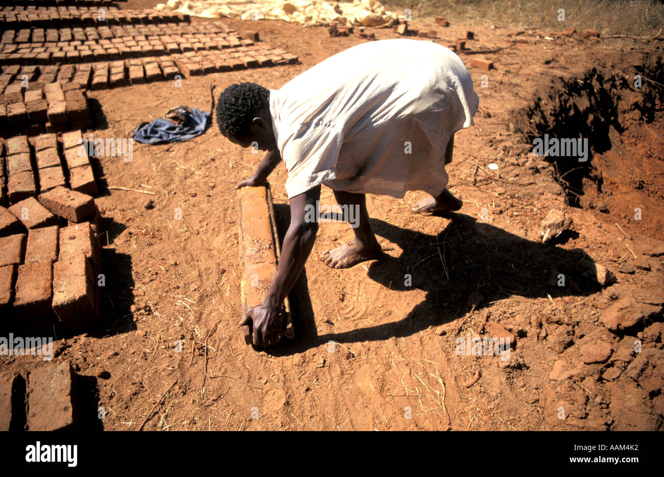 People work africa handmade brick hi-res stock photography and images ...