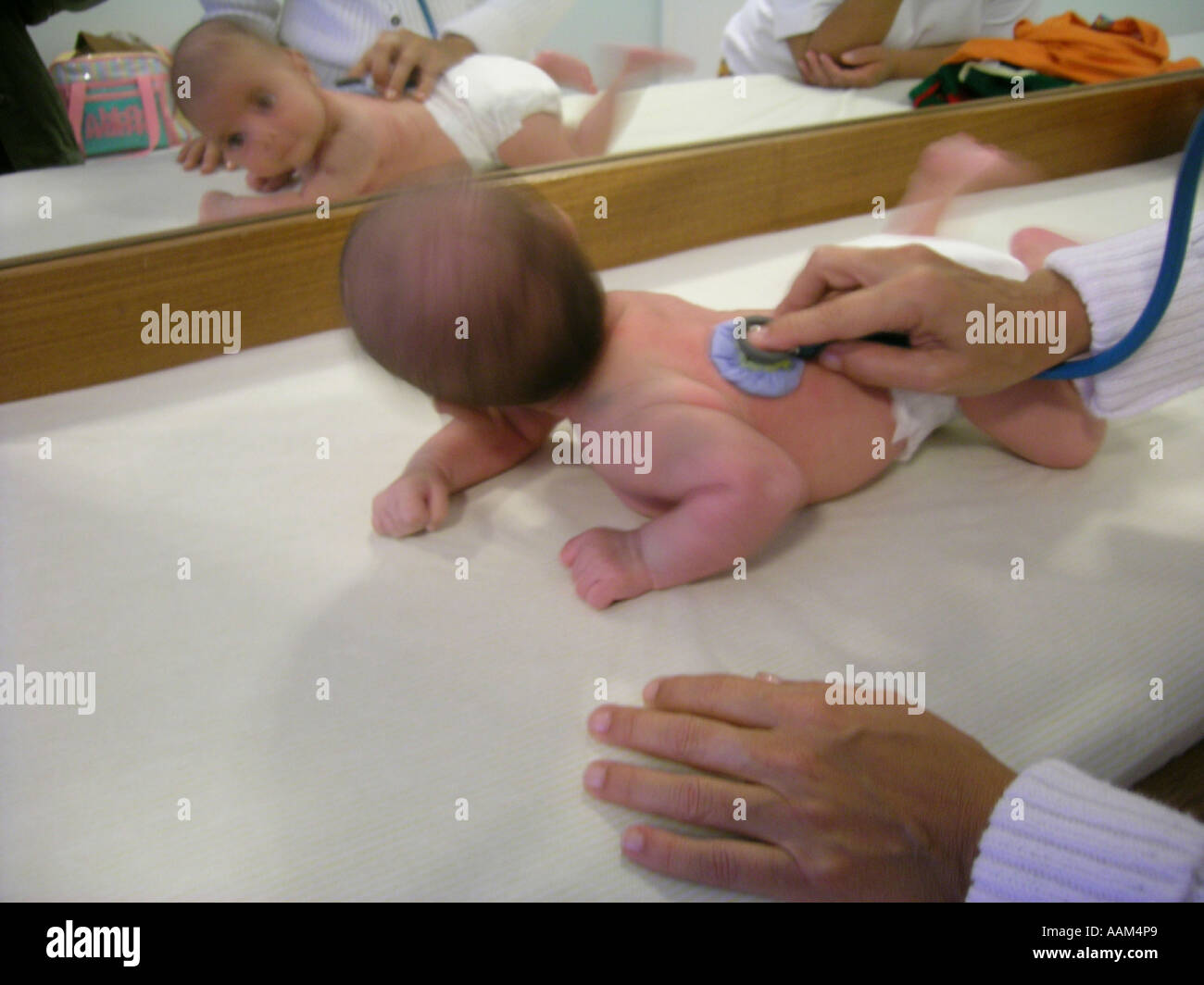 Pediatrician uses a stethoscope in a one month baby in a clinic Stock ...