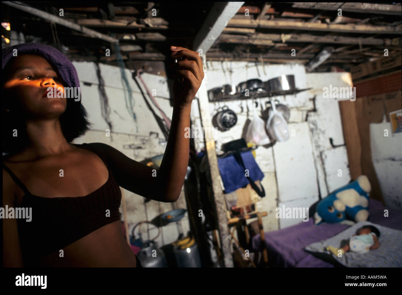 Parenting teenager. Low income family in Brazil. Adolescent mother put ...