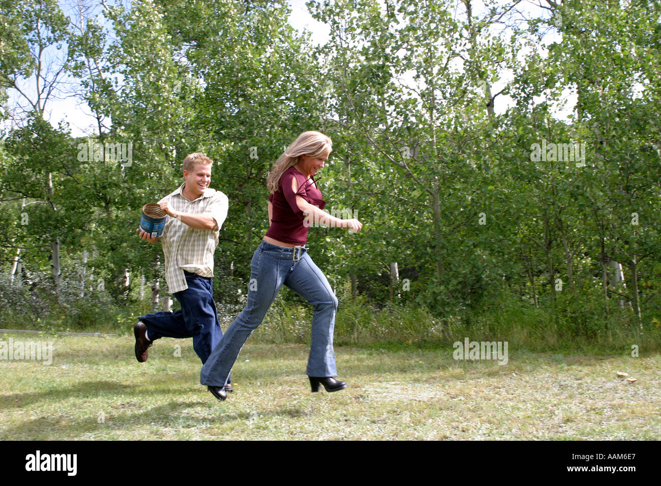 Horizontal Young couple having fun Stock Photo - Alamy