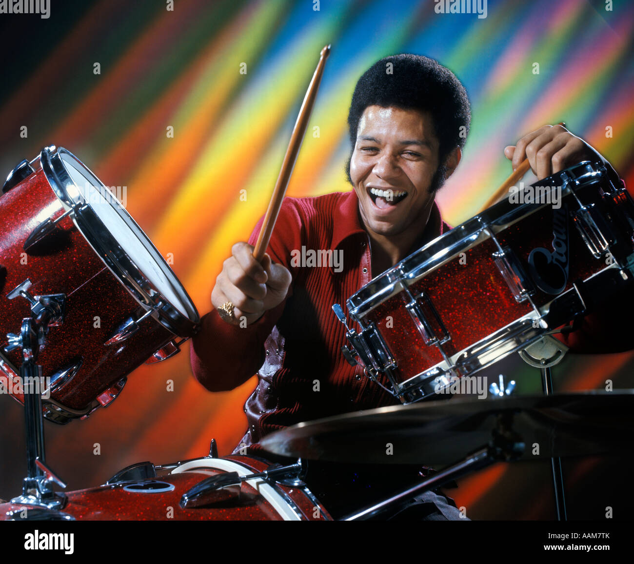 MAN DRUMS DRUMMER MUSIC DRUMSTICKS 1970s 1970 Stock Photo - Alamy