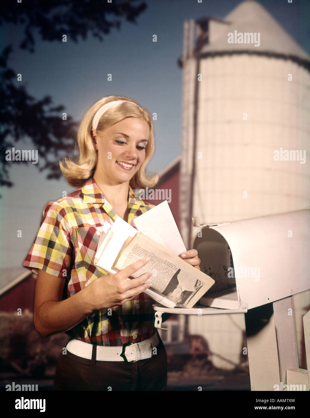 1960 1960s SMILING YOUNG BLOND BLONDE WOMAN TAKING MAIL FROM RURAL ...
