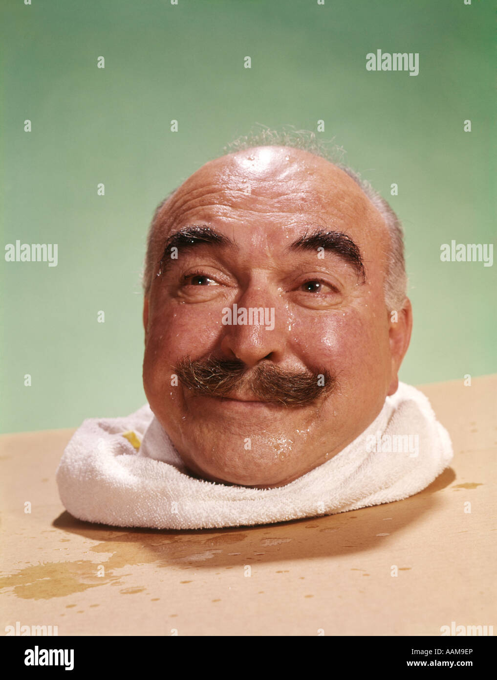 1960s HEAD OF BALD MAN WITH MOUSTACHE PROTRUDING FROM STEAMBATH CHAMBER ...