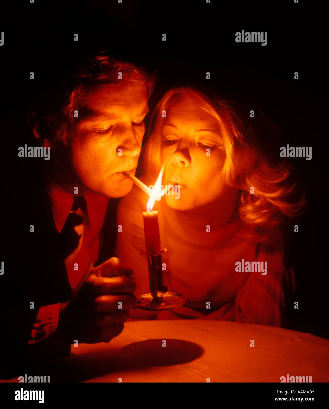 Couple Lighting A Cigarette