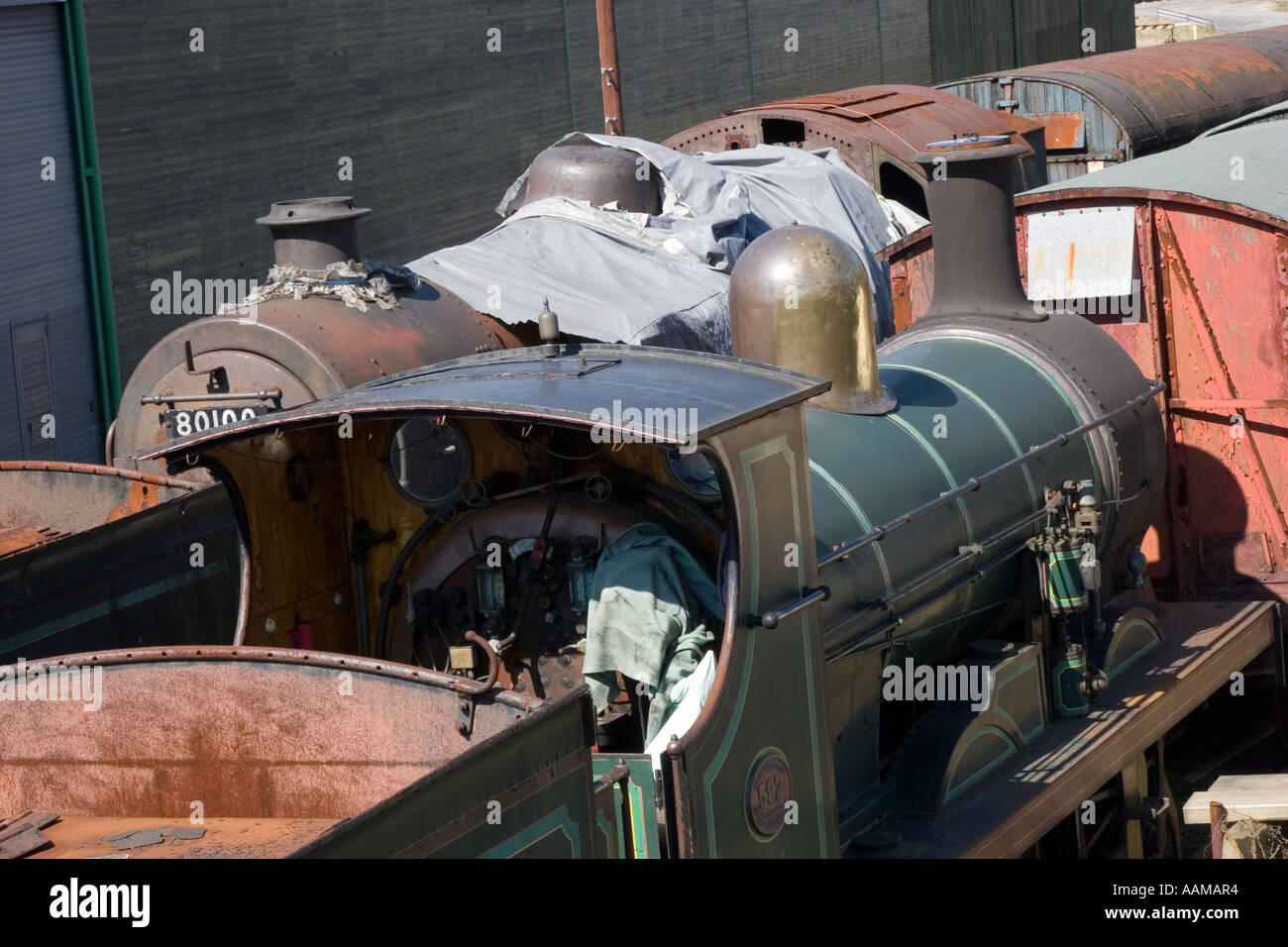Rusty steam locomotives awaiting restoration in a station yard Stock ...