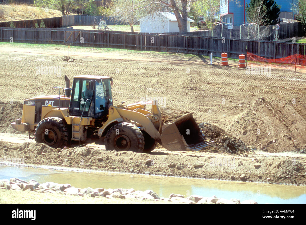 Wheel loader at construction site Stock Photo - Alamy