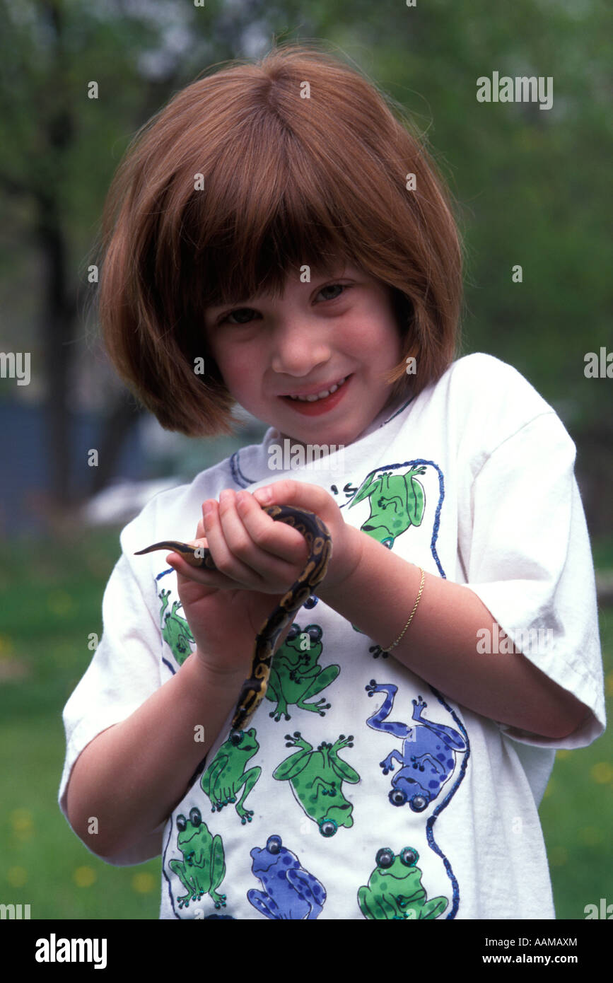 4-YEAR-OLD GIRL HOLDING JUVENILE BALL PYTHON Python regius Stock Photo ...